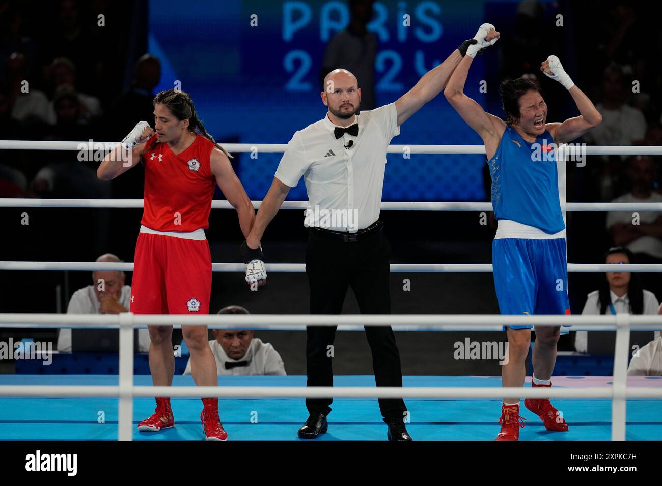 China's Yang Liu, right, reacts after defeating Taiwan's Chen Nien-chin ...