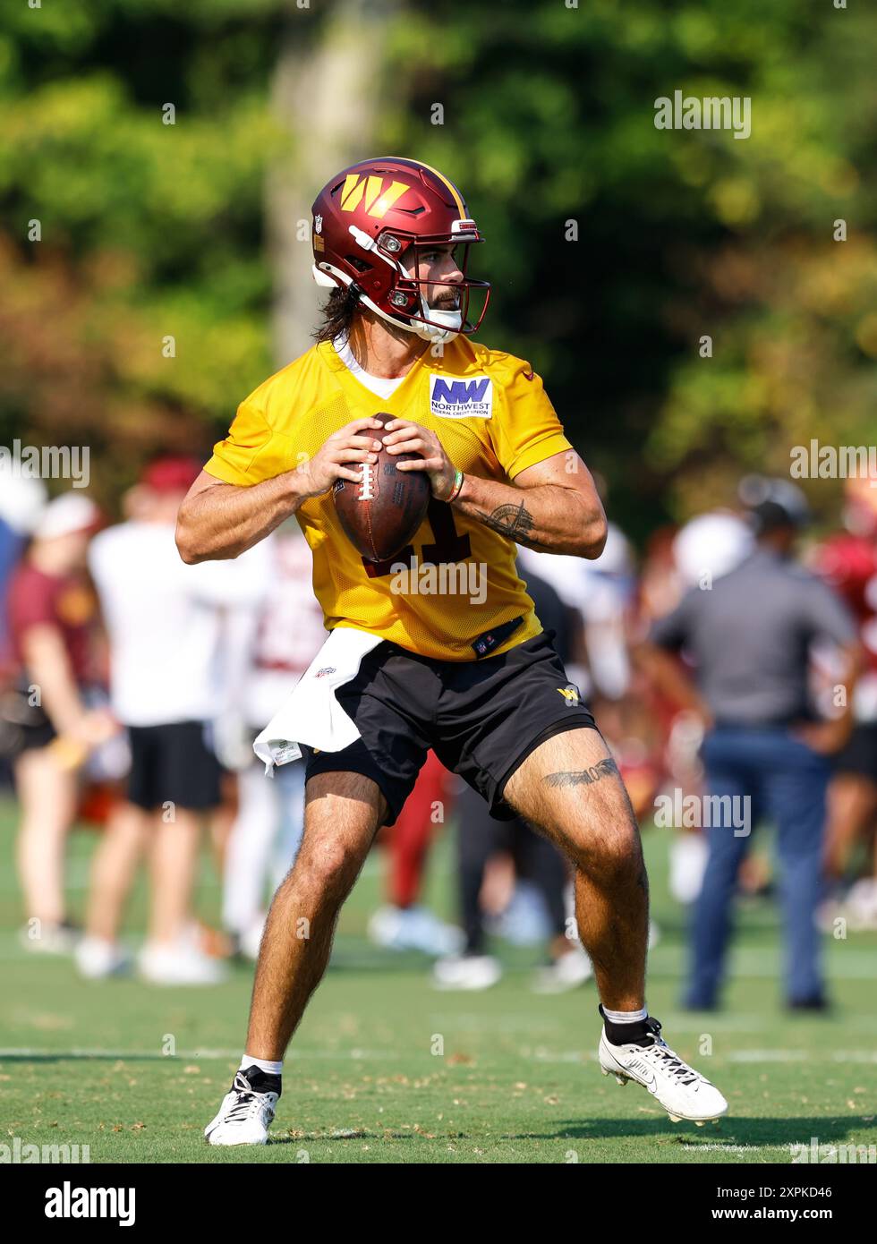 Washington Commanders quarterback Sam Hartman (11) performing drills ...
