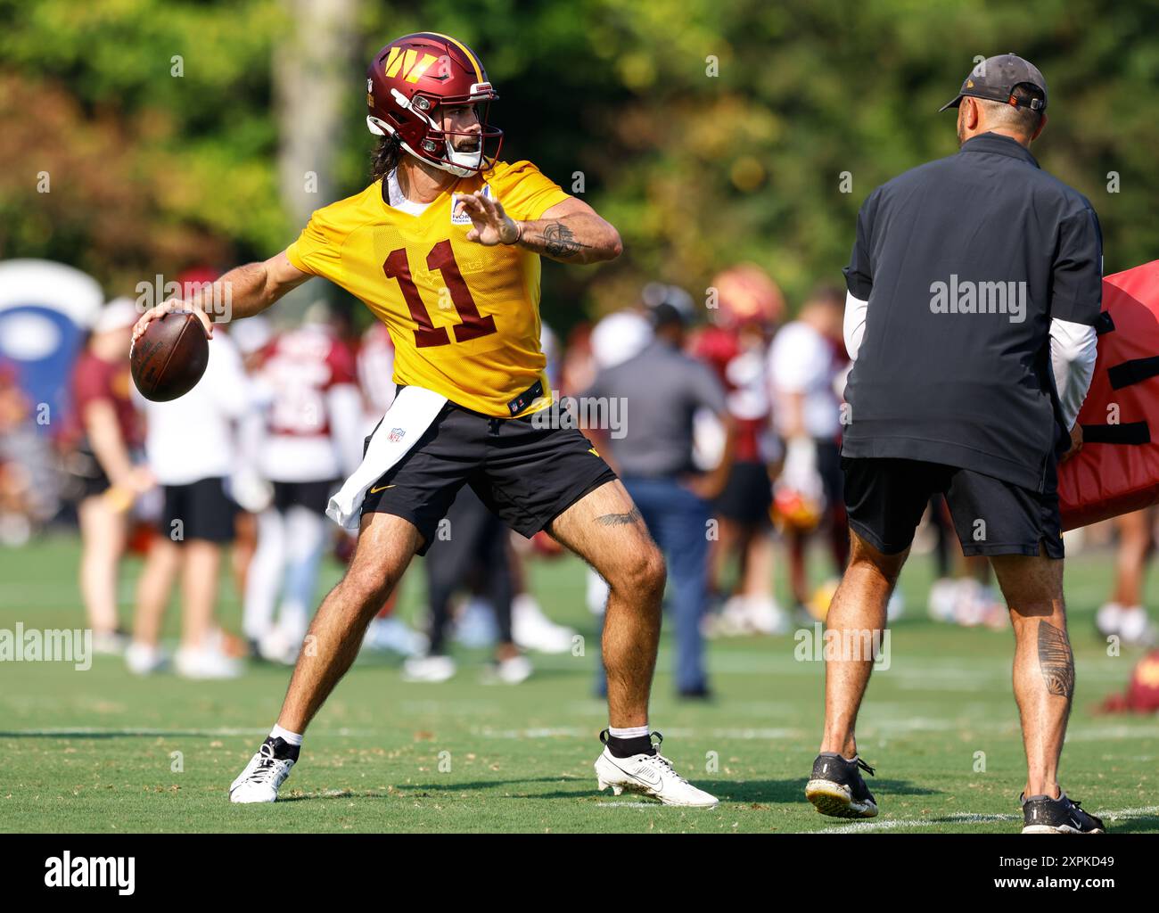 Washington Commanders quarterback Sam Hartman (11) performing drills ...