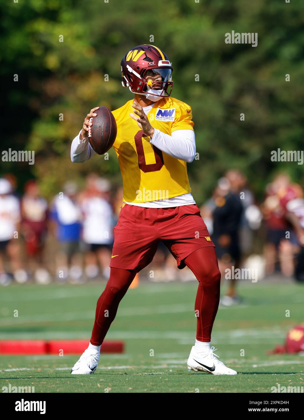 Washington Commanders quarterback Marcus Mariota (0) performing drills ...