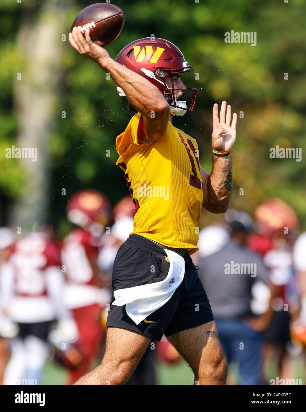 Washington Commanders quarterback Sam Hartman (11) performing drills ...