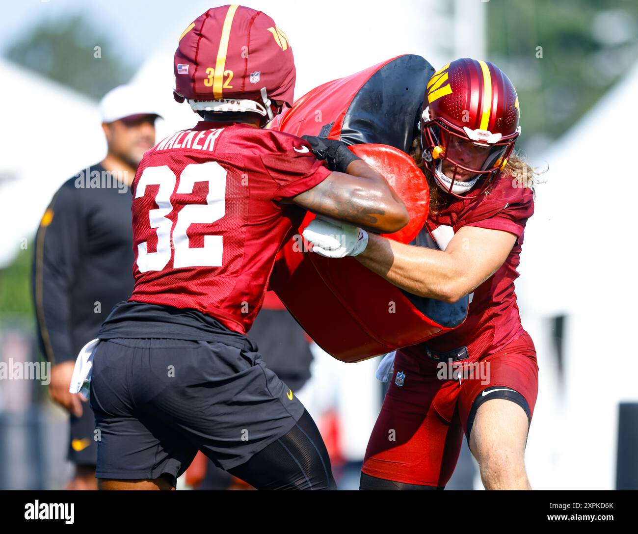 Washington Commanders line backer Mykal Walker (32) and Bo Bauer (51 ...