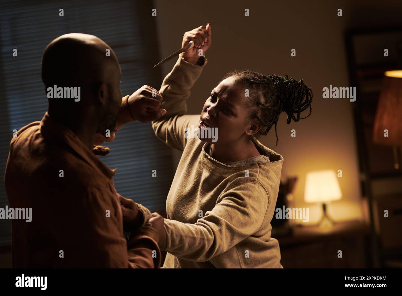 Man with knife attacking woman hi-res stock photography and images - Alamy
