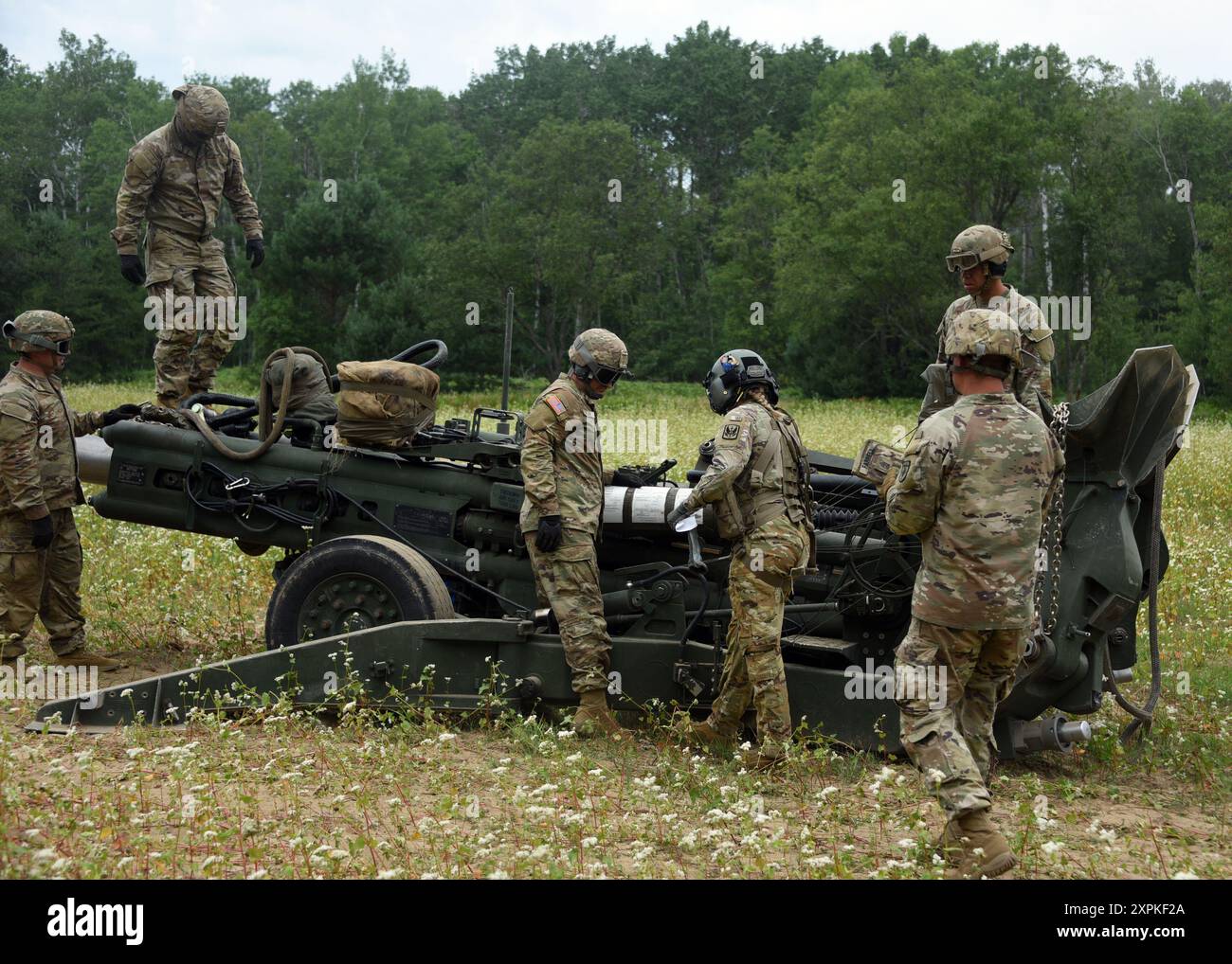 Michigan National Guard soldiers from Charlie Battery, 1-119 Field Artillery, Albion, MI ready a ...