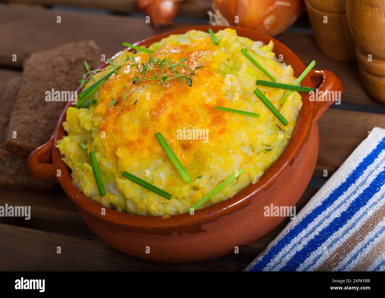 Clay pot of potato casserole Stock Photo - Alamy