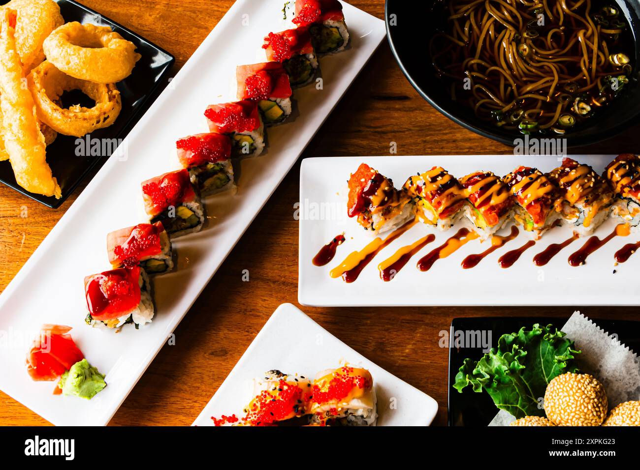 Shot of multiple food dishes prepared at an Asian sushi restaurant ...
