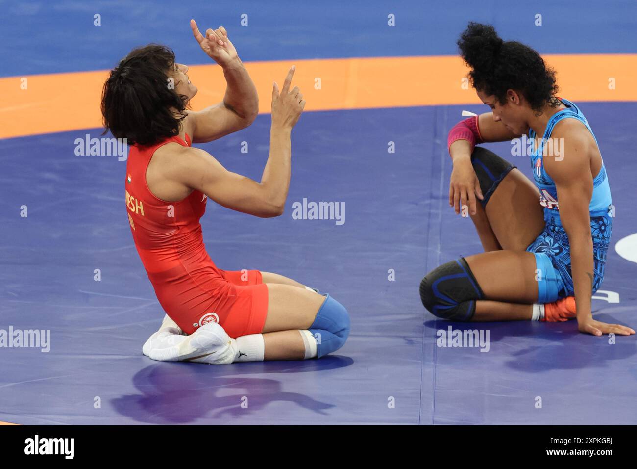 Paris, France. 6th Aug, 2024. Vinesh Vinesh (in red) of India competes ...