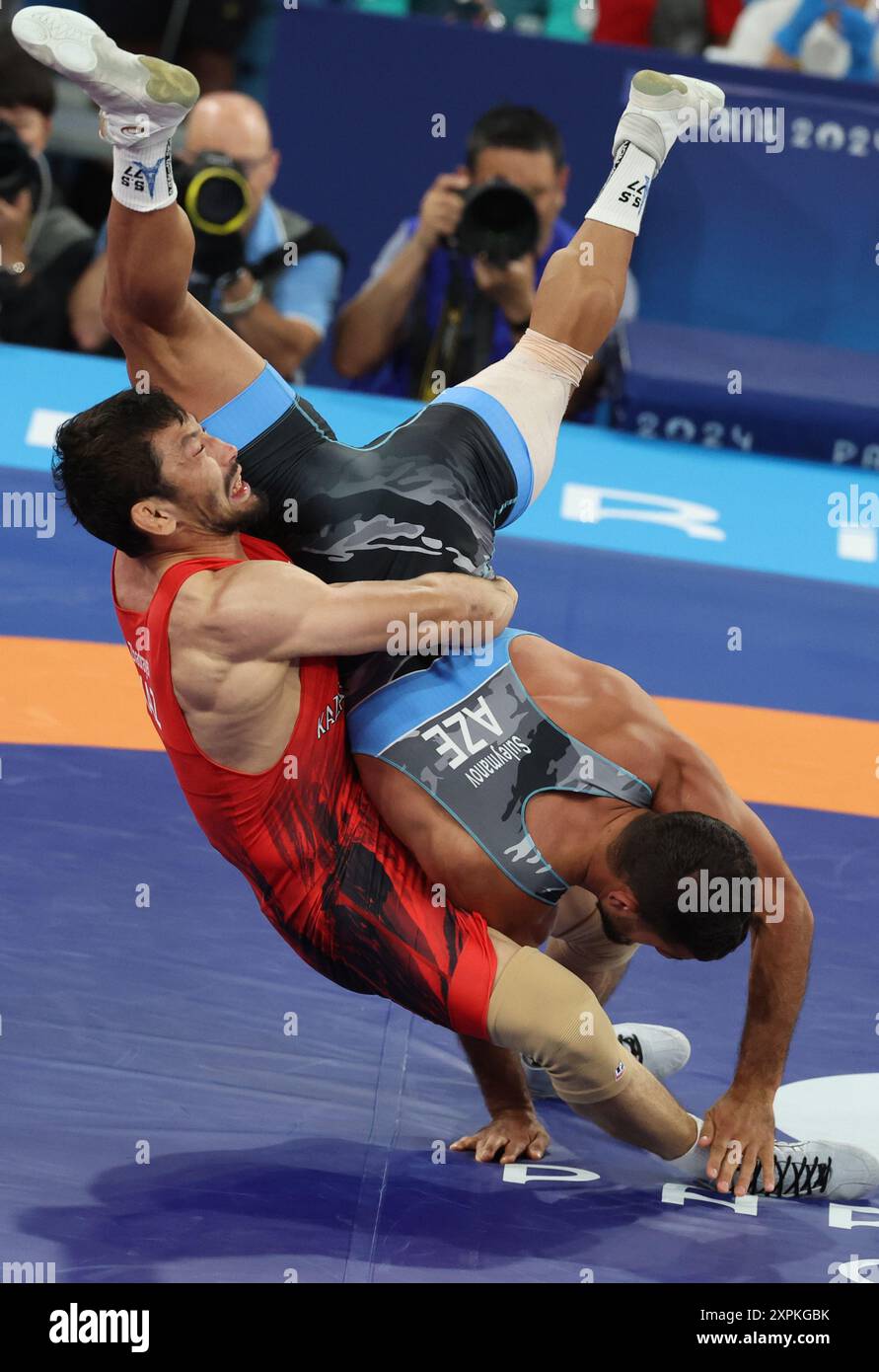 (240806) -- PARIS, Aug. 6, 2024 (Xinhua) -- Sanan Suleymanov (R) of ...