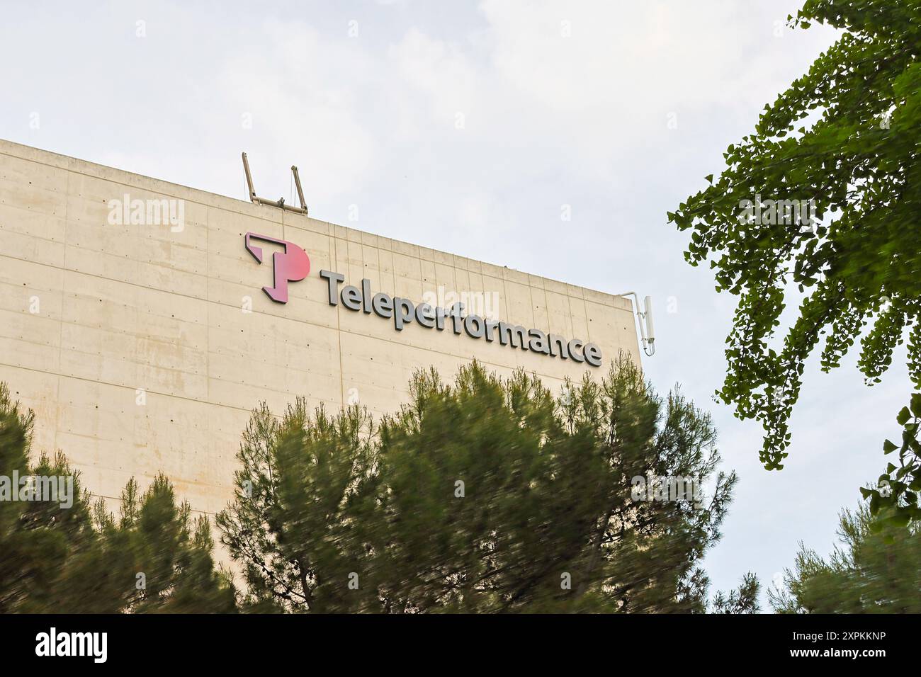 View of the teleperformance building exterior showcasing its brand logo ...