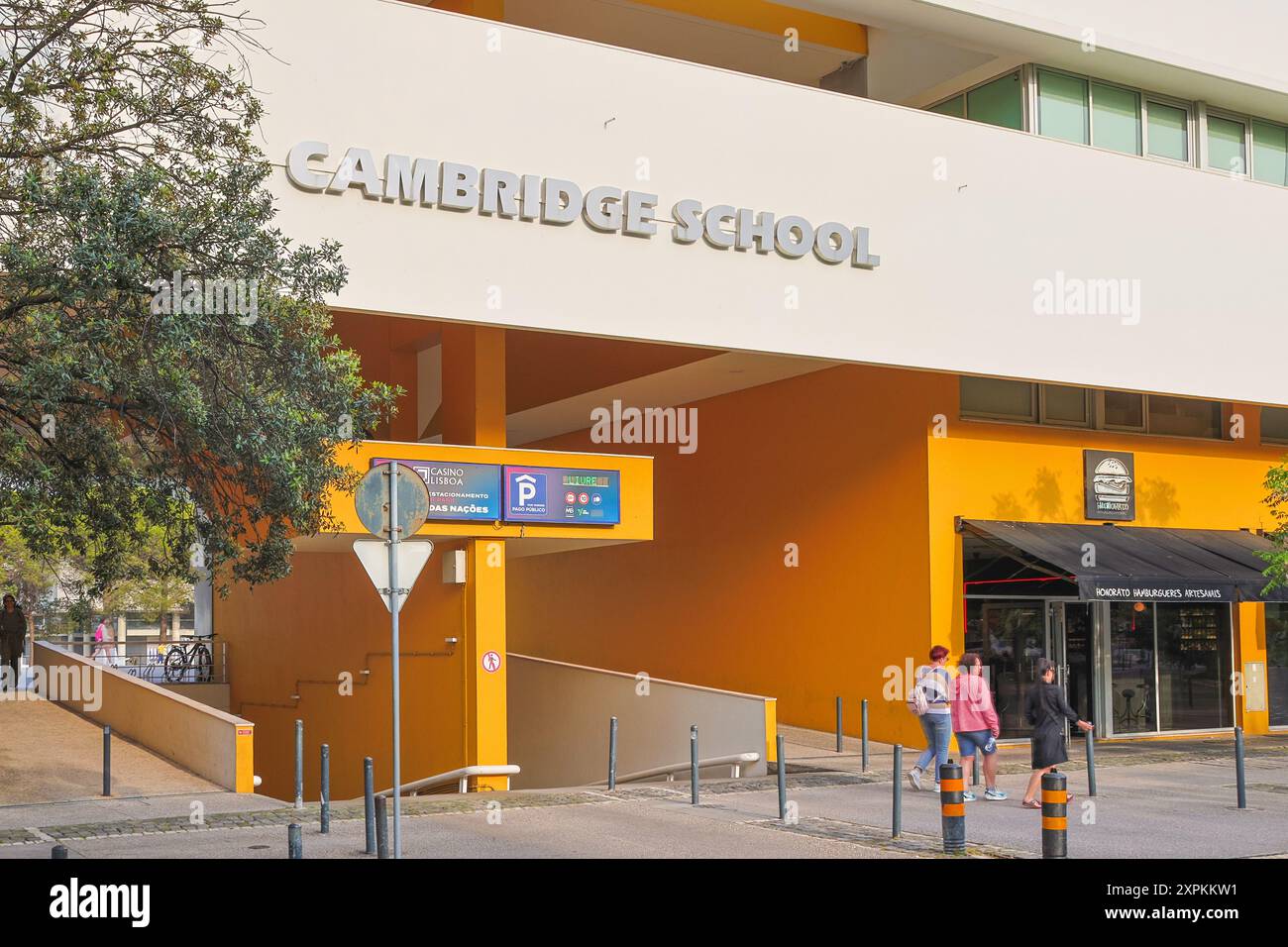 Exterior of cambridge school with visitors, located in nations' park ...