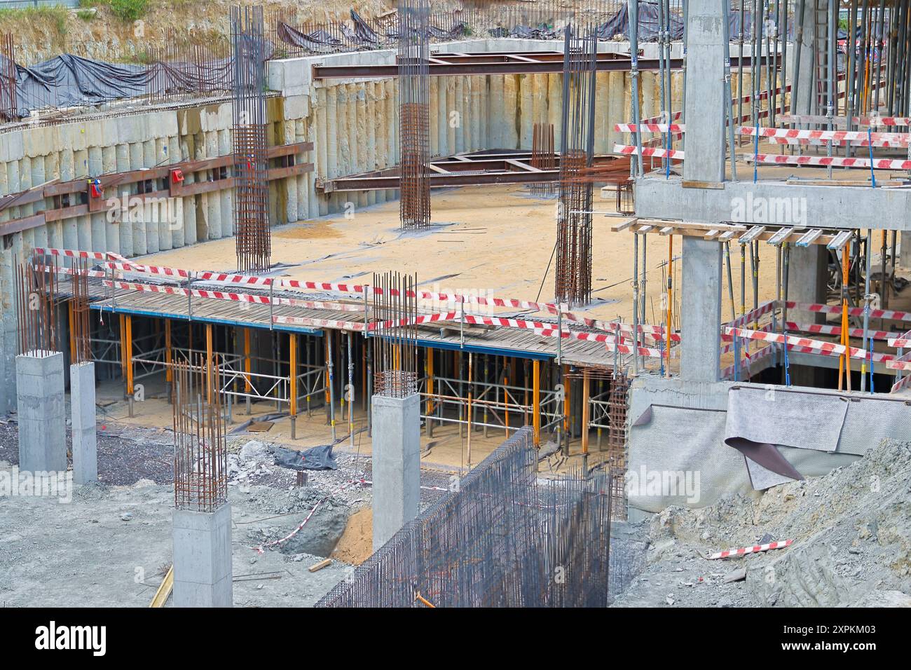 Active building site with concrete foundations and varied construction ...