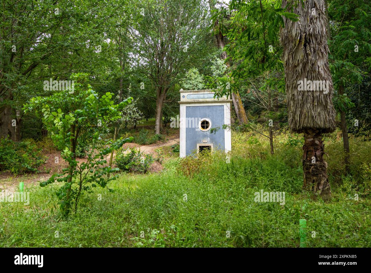 Lush park landscape featuring a quaint structure at quinta das conchas ...