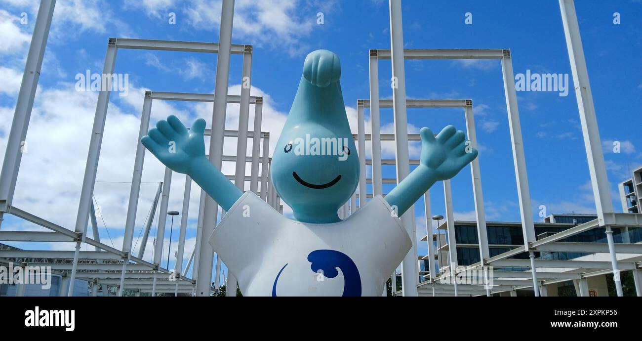Friendly water drop mascot character with open arms in front of a water ...