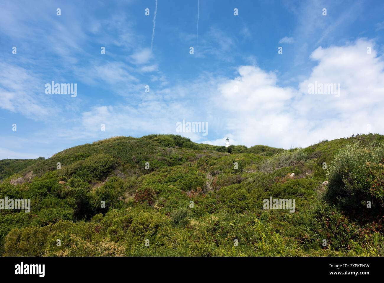 Natural landscape of the hill with the lighthouse in Othonoi island ...