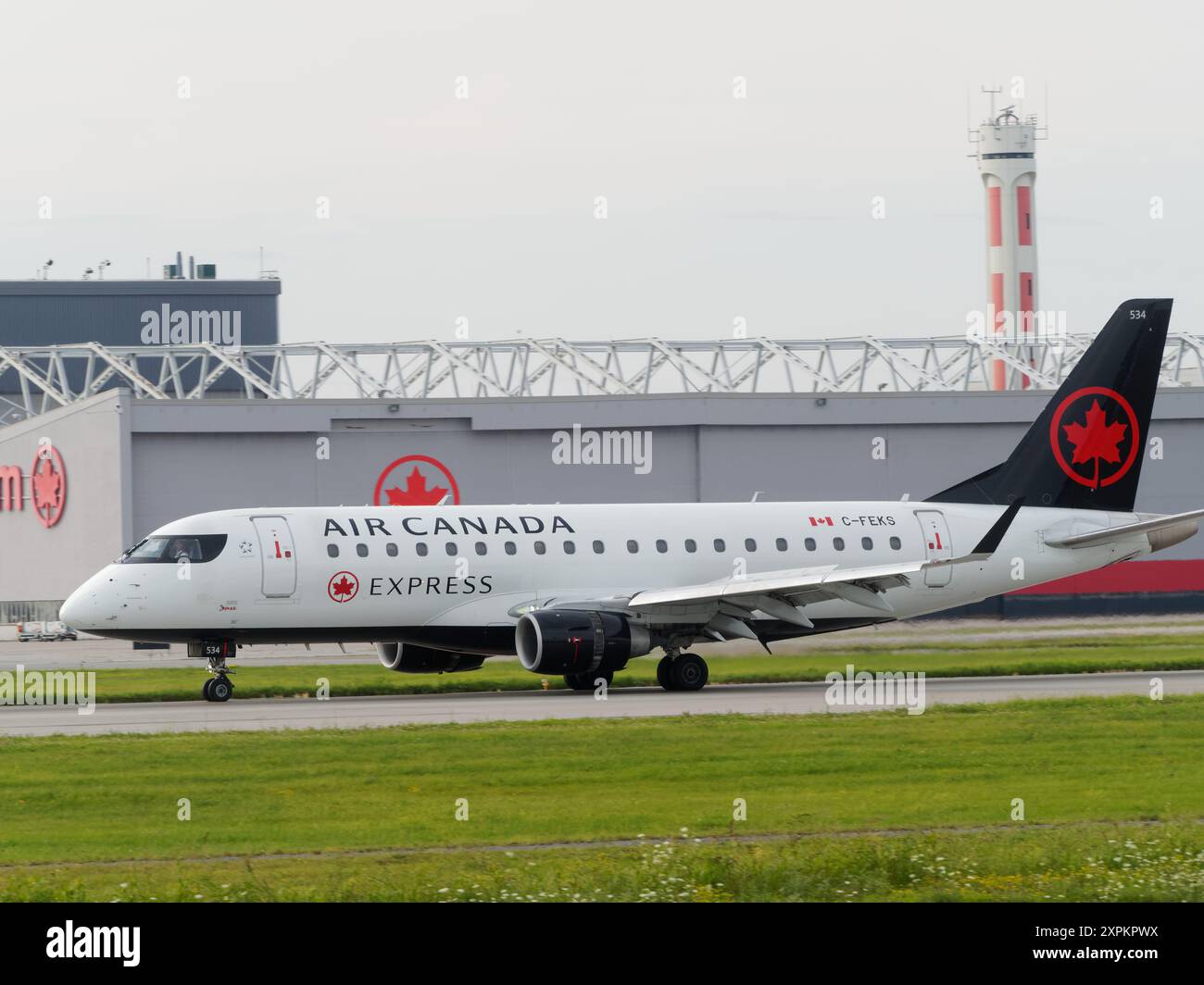 Air Canada Express Embraer E175 on the runway at the Montréal-Pierre Elliott Trudeau ...