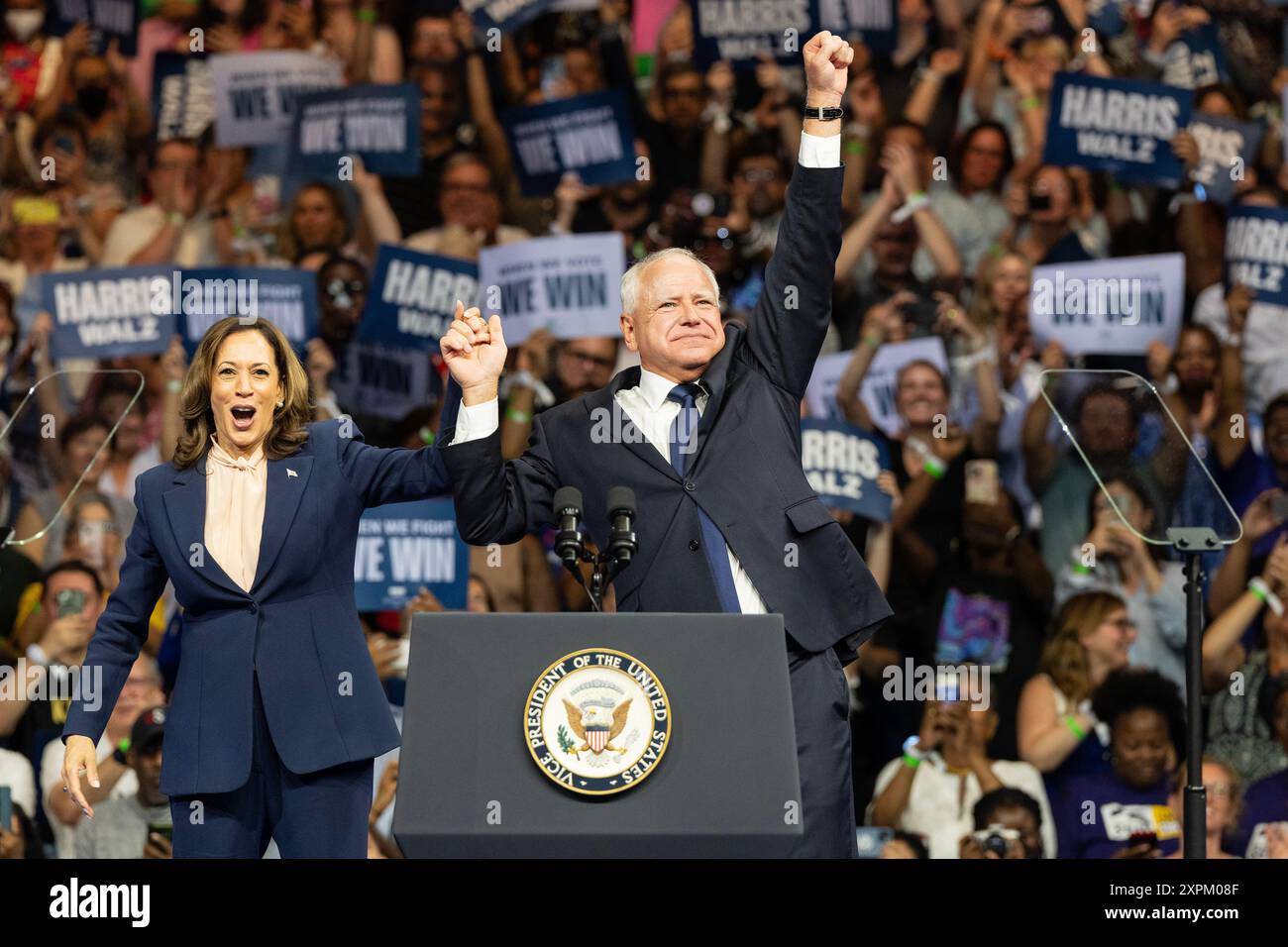 Kamala Harris and Tim Walz on stage at the rally in Liacouras Center at ...