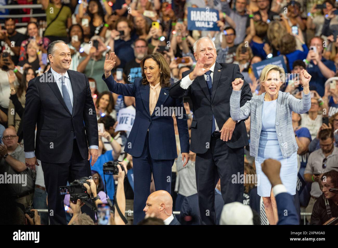 Douglas Emhoff, Kamala Harris, Tim Walz, Gwen Walz on stage at the ...
