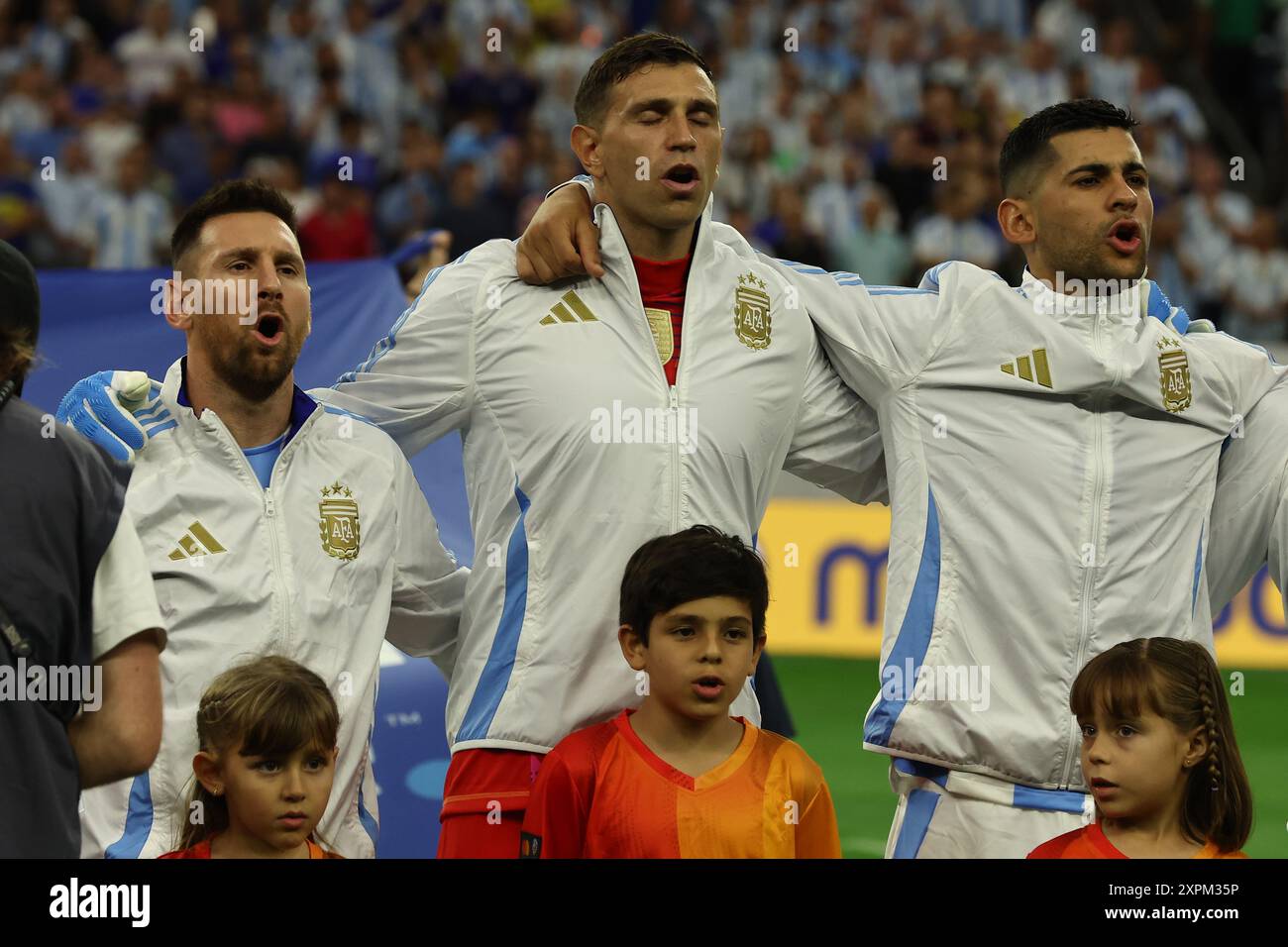(L to R) Argentina's forward Lionel Messi, goalkeeper Emiliano Martinez ...