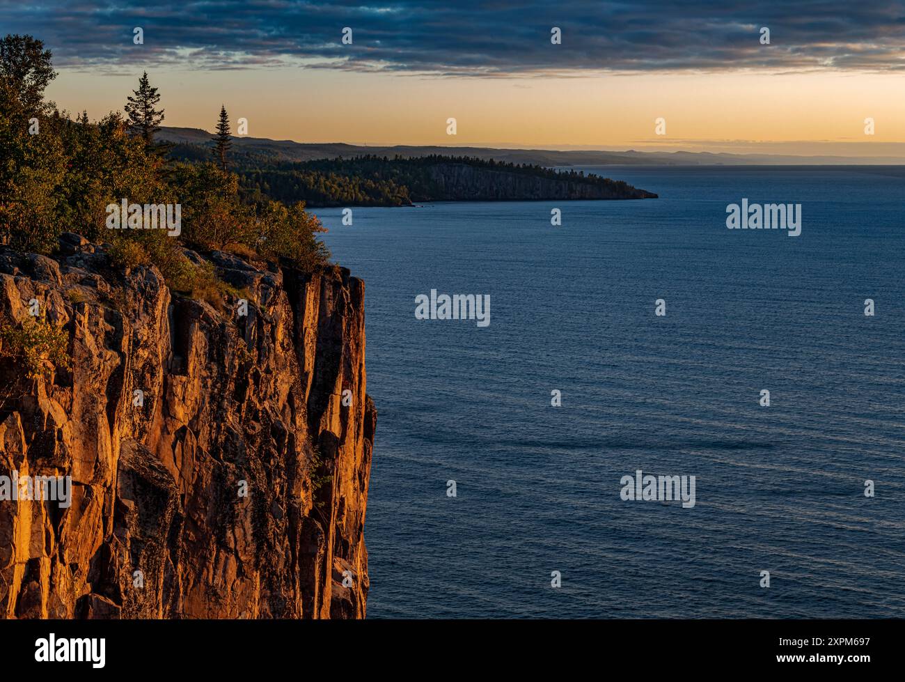 Palisade Head, the Lake Superior shore are seen just before sunset ...