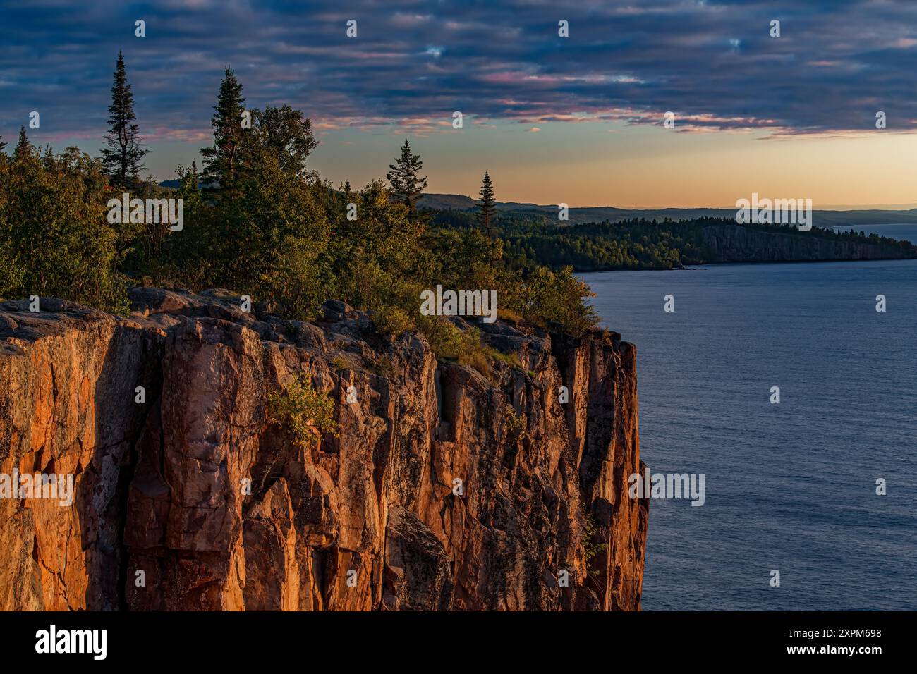 Palisade Head, the Lake Superior shore are seen just before sunset ...