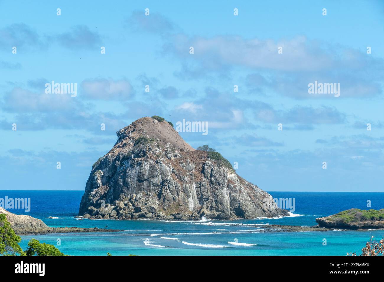 Fernando de Noronha, Brazil. View of Morro dos Dois Irmaos with plants ...