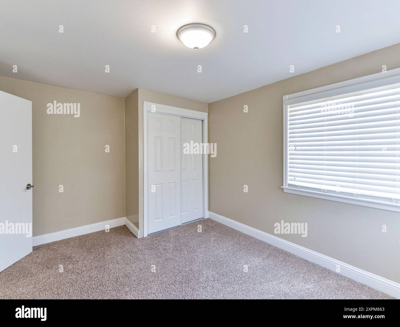 Modern residential empty bedroom interior Stock Photo - Alamy