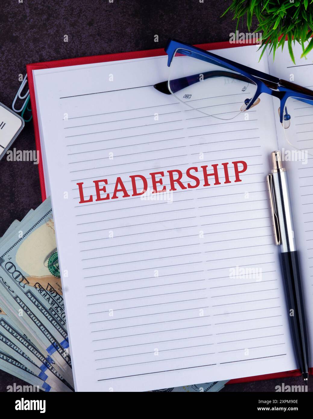 LEADERSHIP word written in a notebook, a vertical photo Stock Photo - Alamy