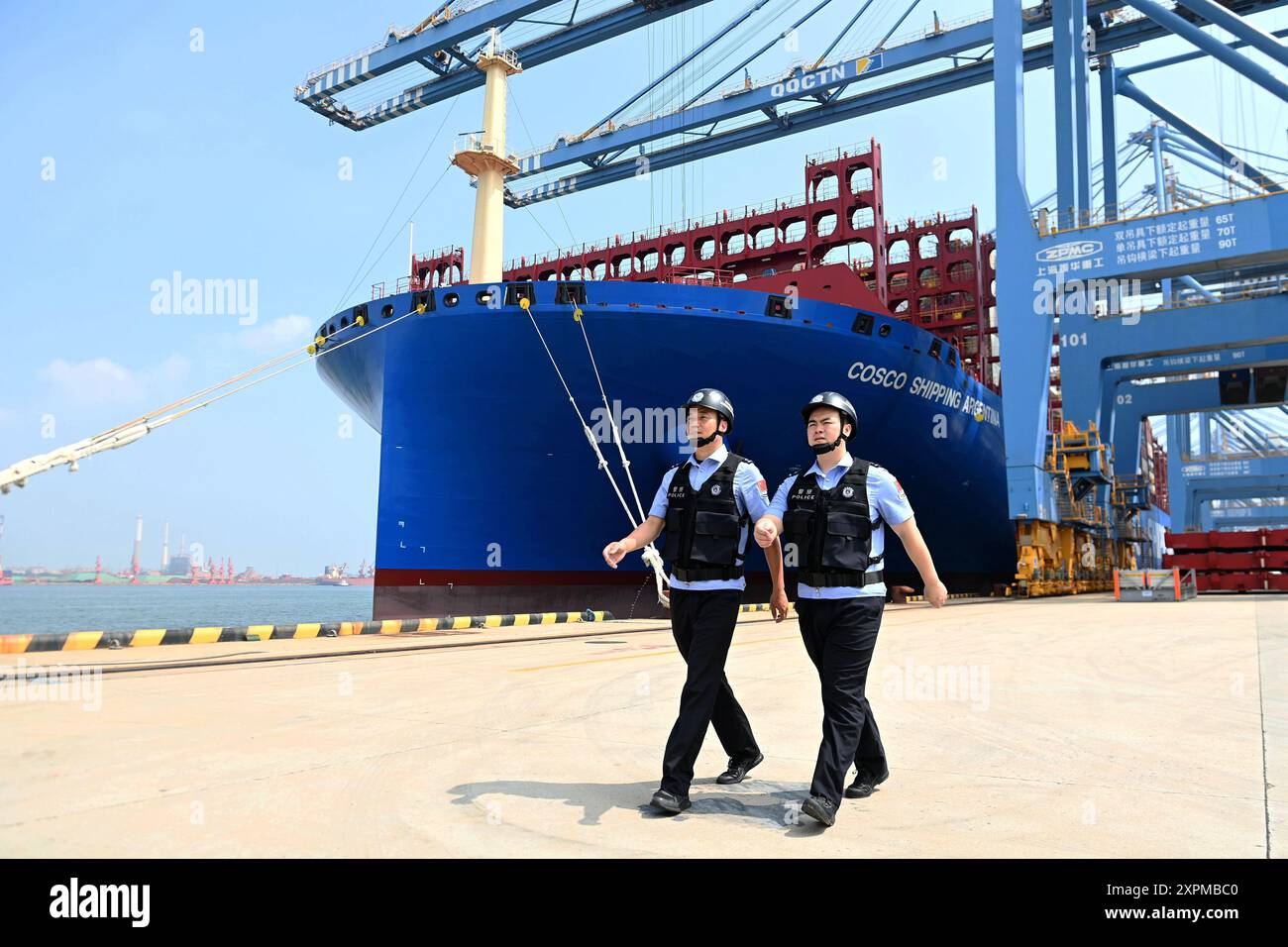QINGDAO, CHINA - AUGUST 7, 2024 - Police officers inspect cargo ship ...