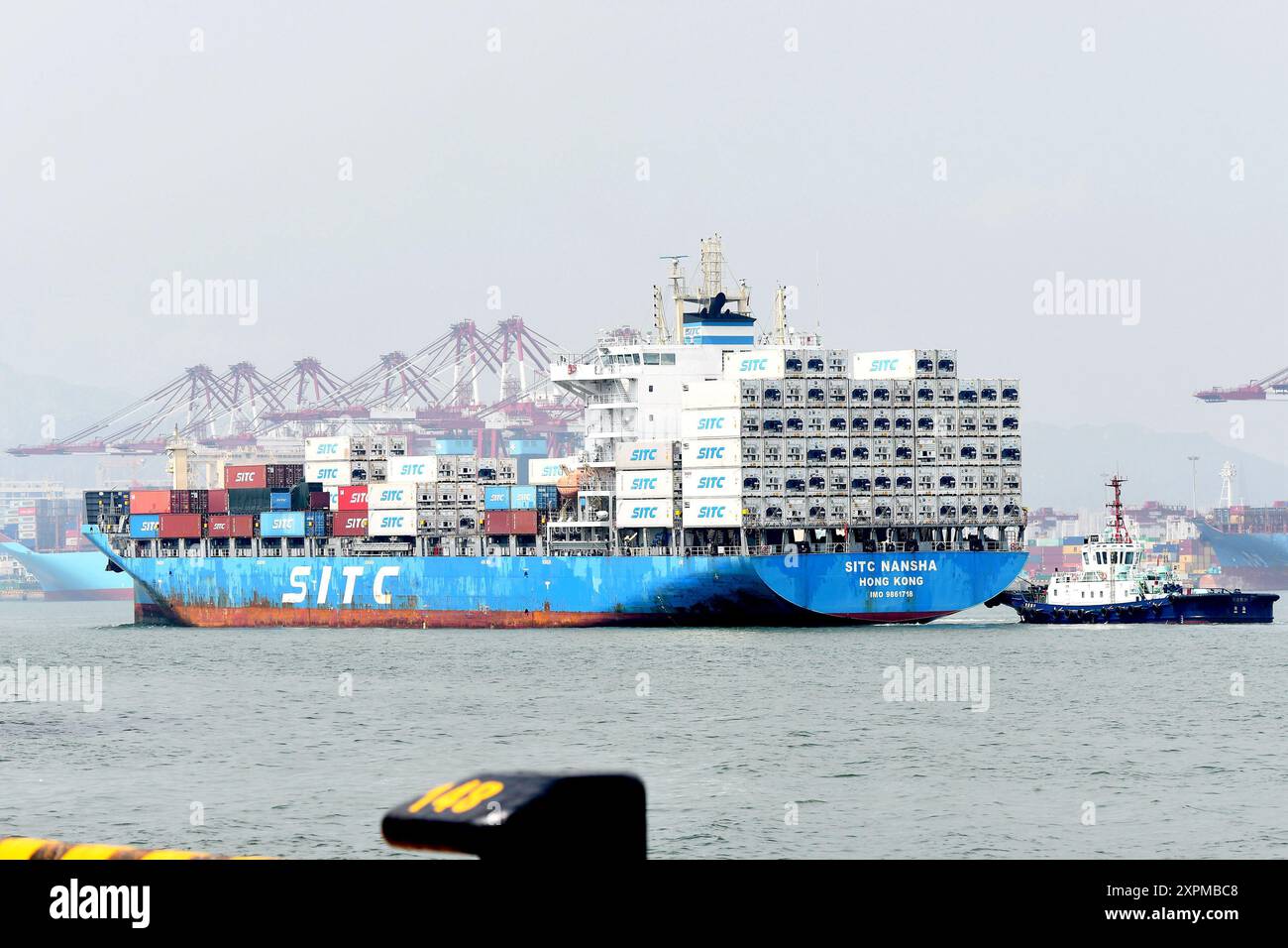 QINGDAO, CHINA - AUGUST 7, 2024 - Cargo ships load and unload foreign ...