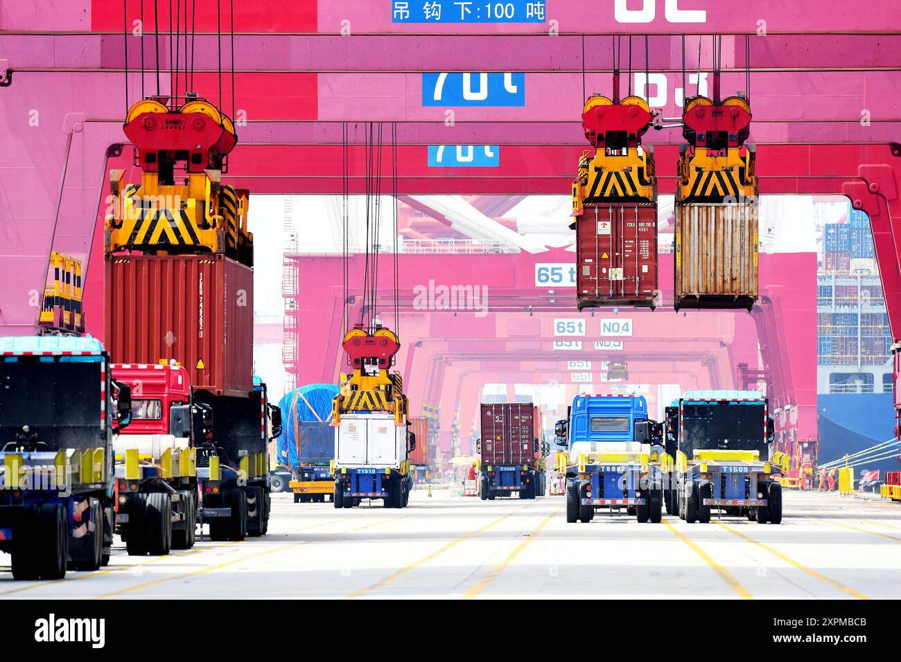 QINGDAO, CHINA - AUGUST 7, 2024 - Cargo ships load and unload foreign ...