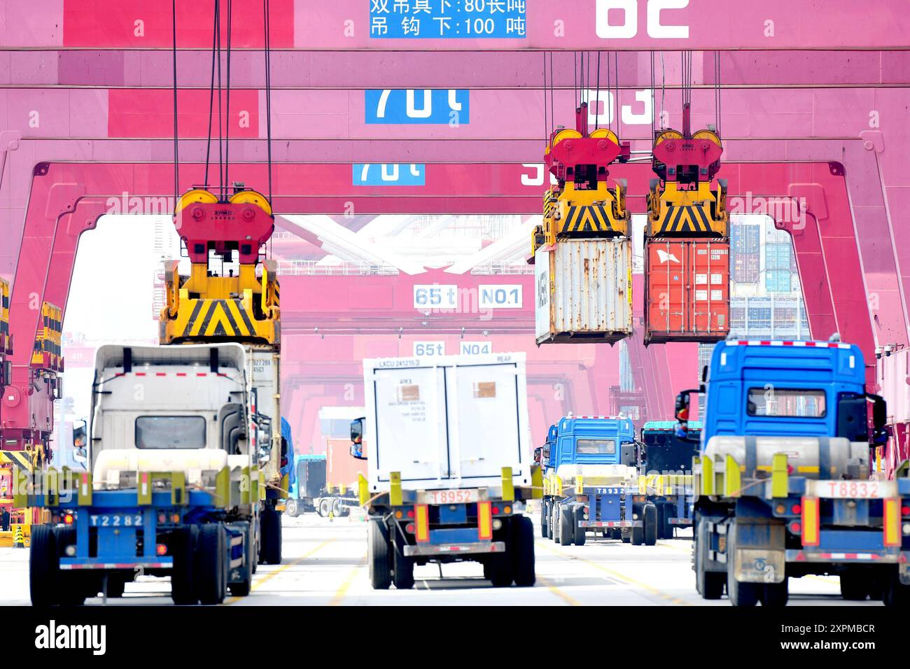 QINGDAO, CHINA - AUGUST 7, 2024 - Cargo ships load and unload foreign ...