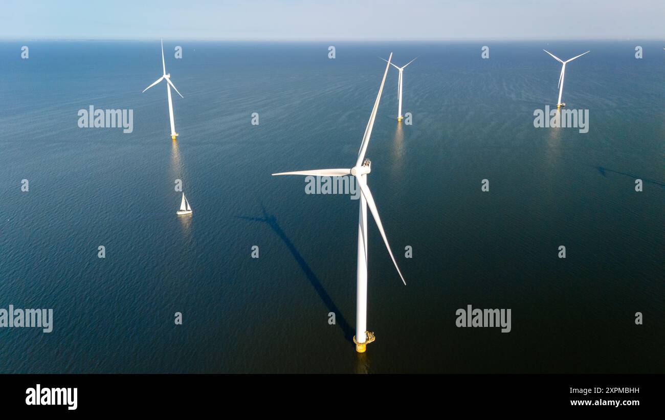 Offshore windmills against beautiful sunset hi-res stock photography ...