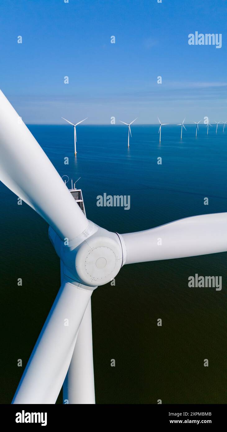 Tall wind turbines harnessing coastal winds hi-res stock photography ...
