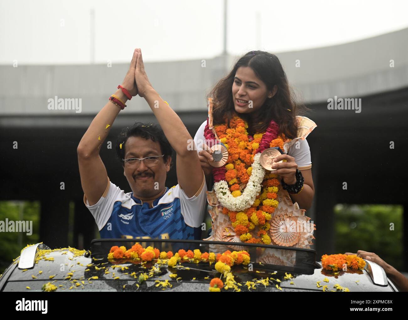 Delhi, New Delhi, India. 7th Aug, 2024. India's shooter Manu Bhaker (C ...