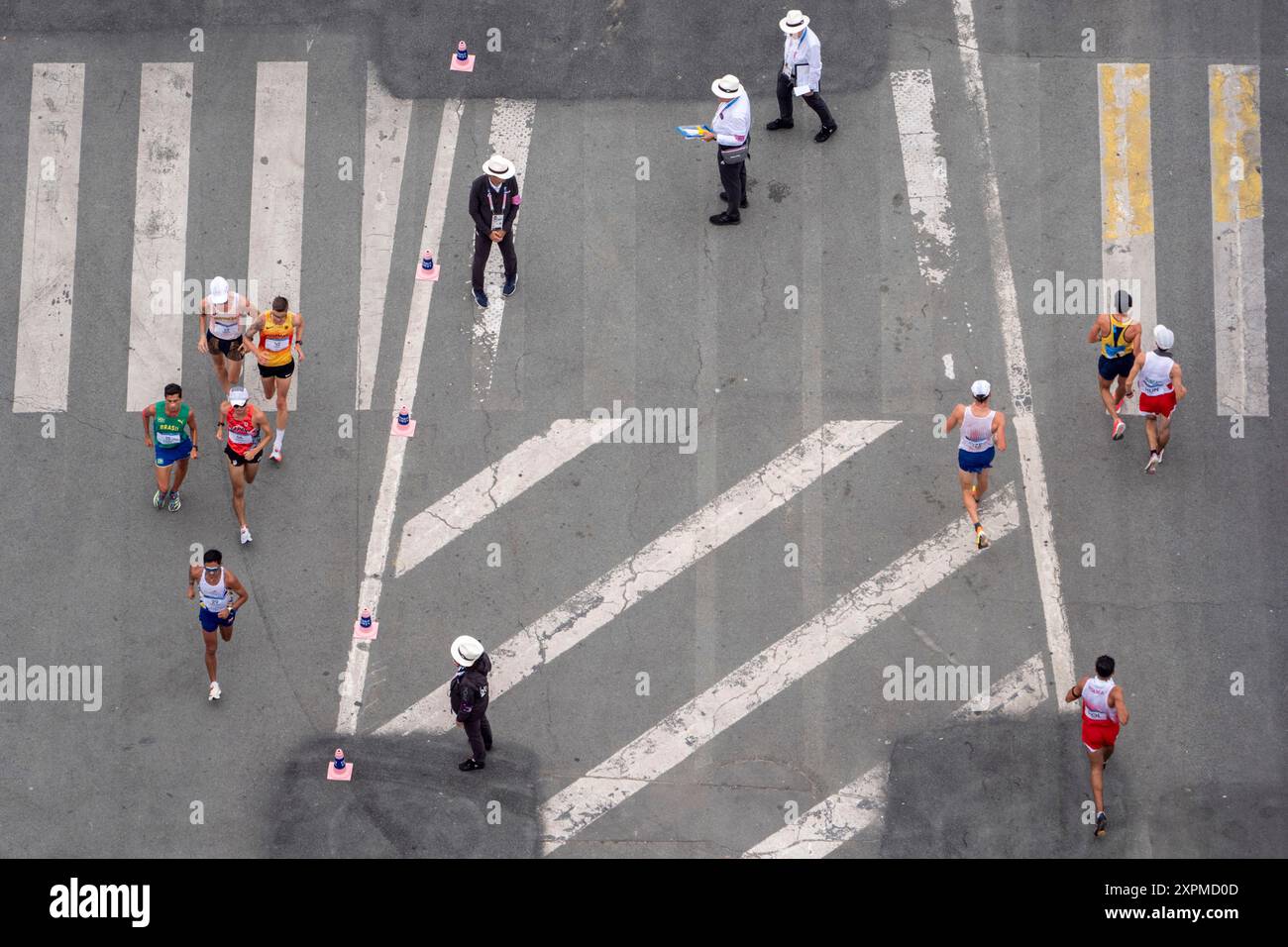 Competitors pass each other during the marathon race walk relay mixed ...