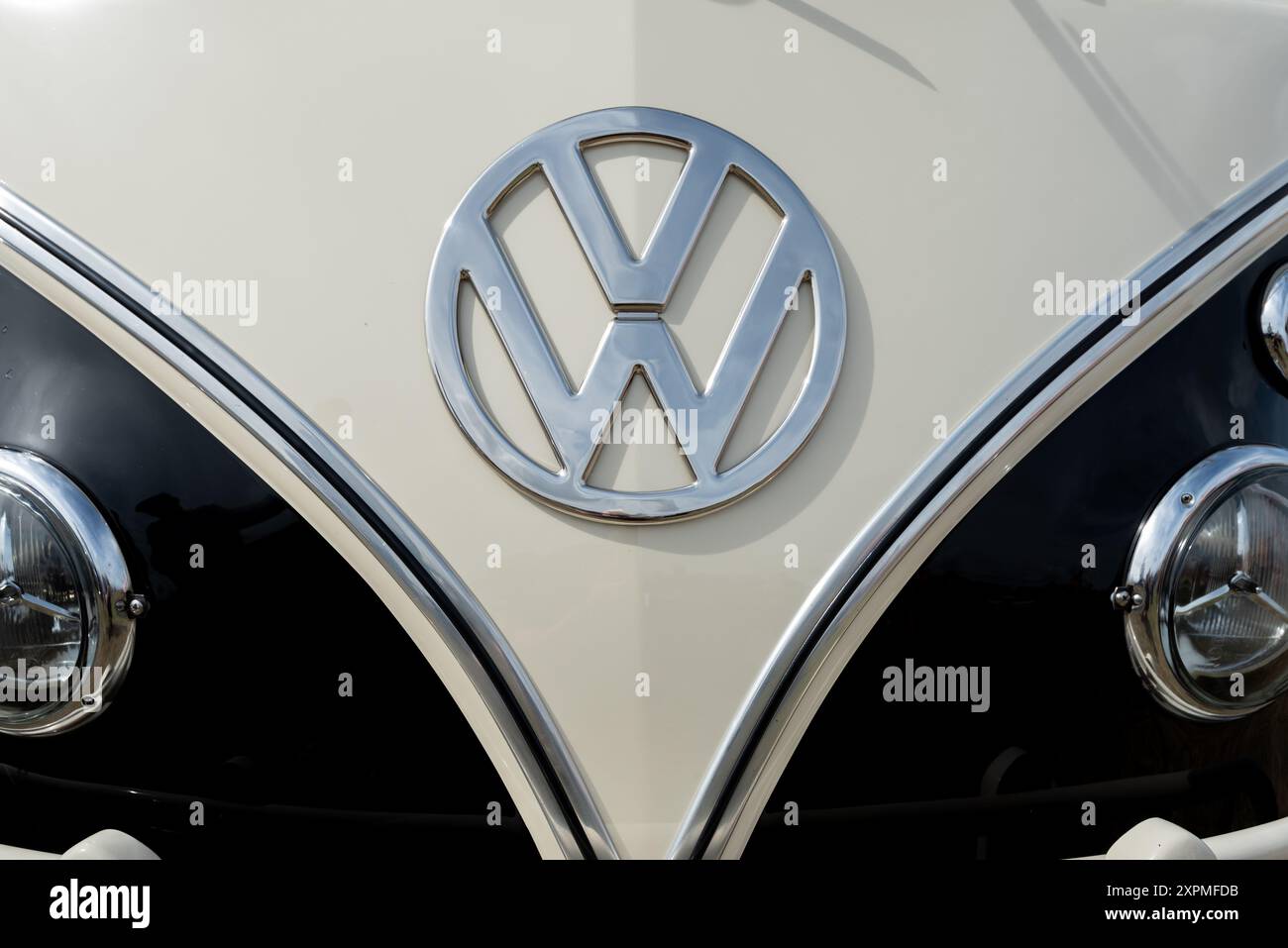 Two tone front of a Volkswagen camper van, showing the company logo or ...