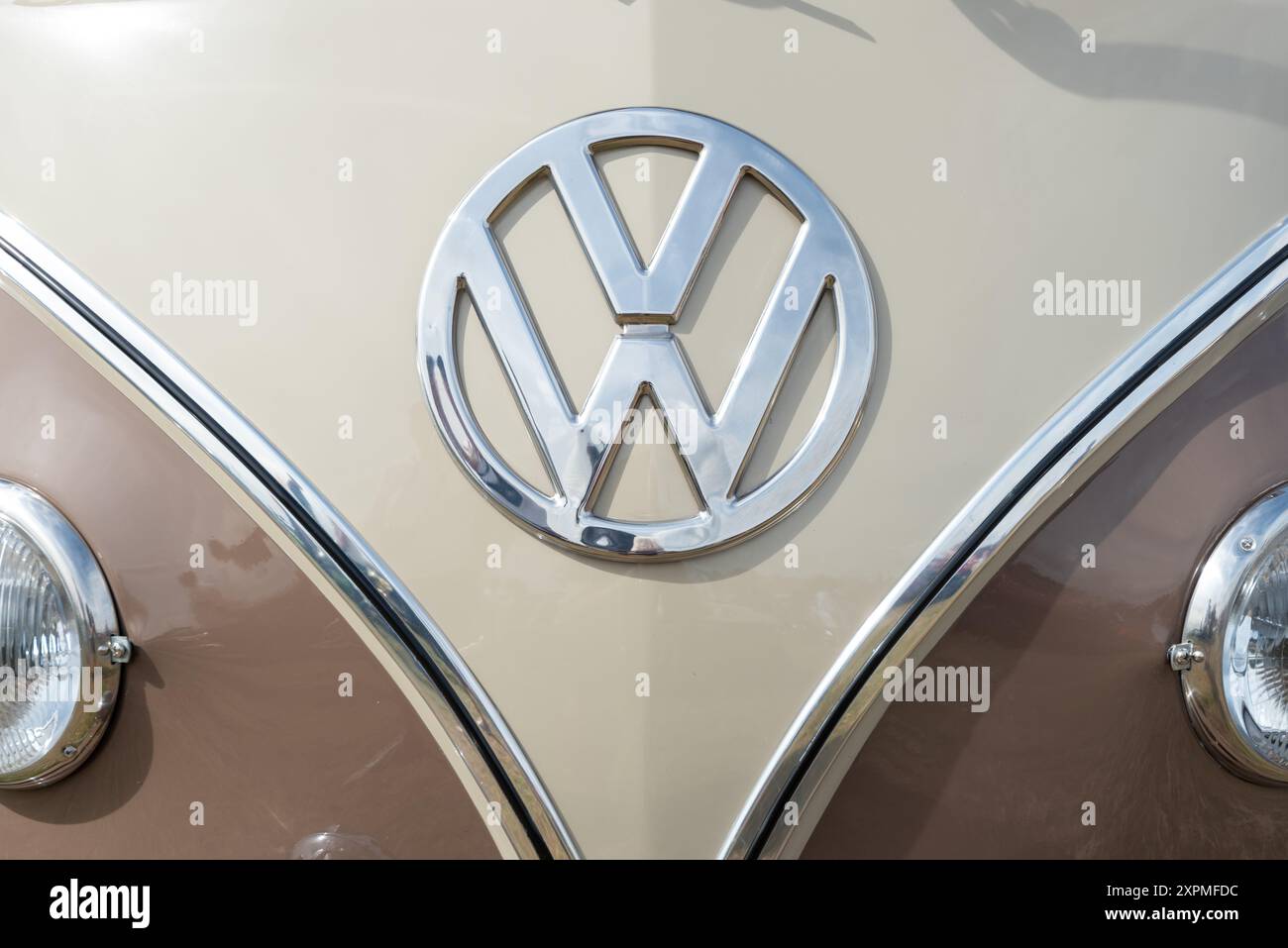 Two tone front of a Volkswagen camper van, showing the company logo or ...
