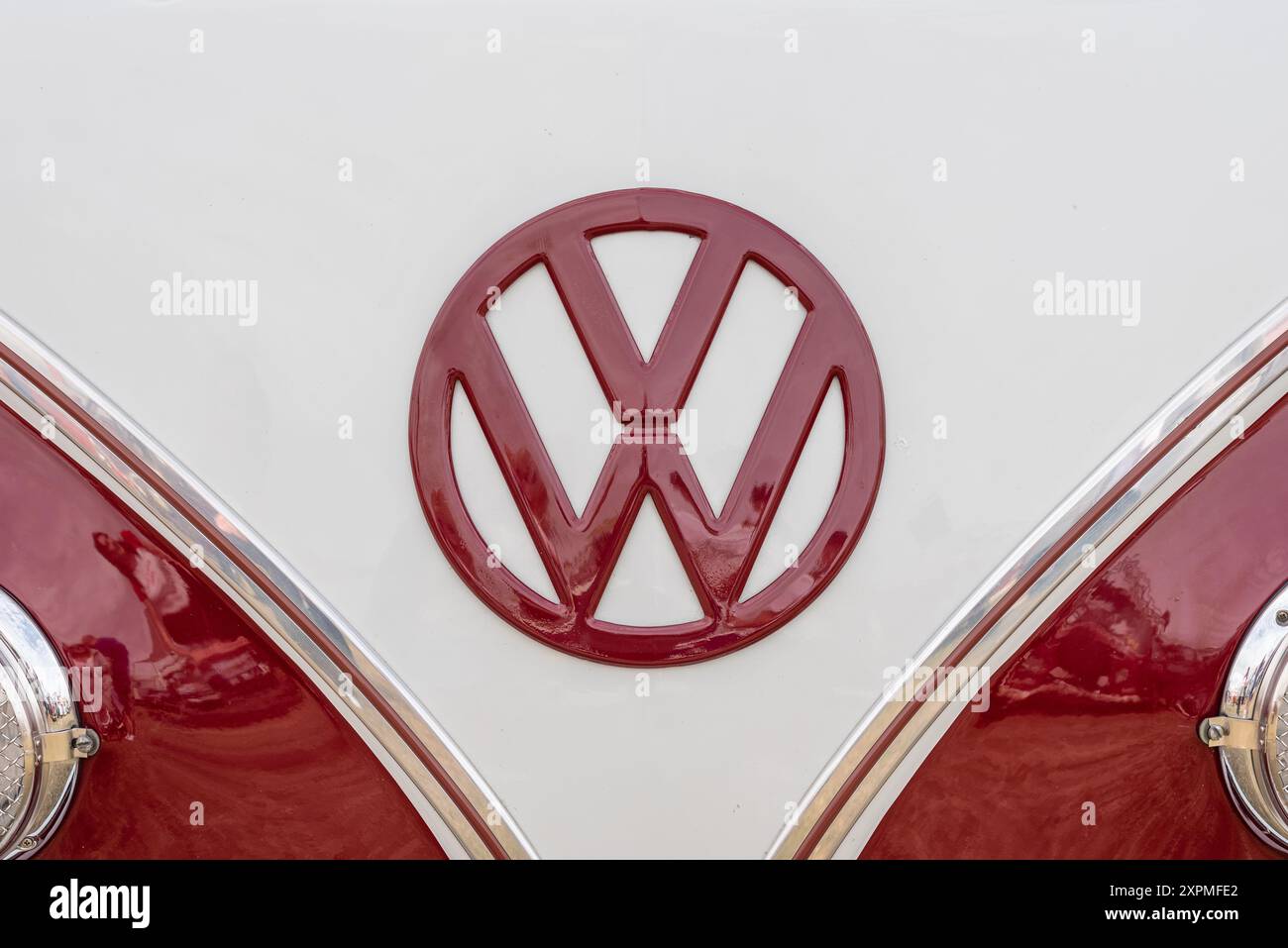 Two tone front of a Volkswagen camper van, showing the company logo or ...