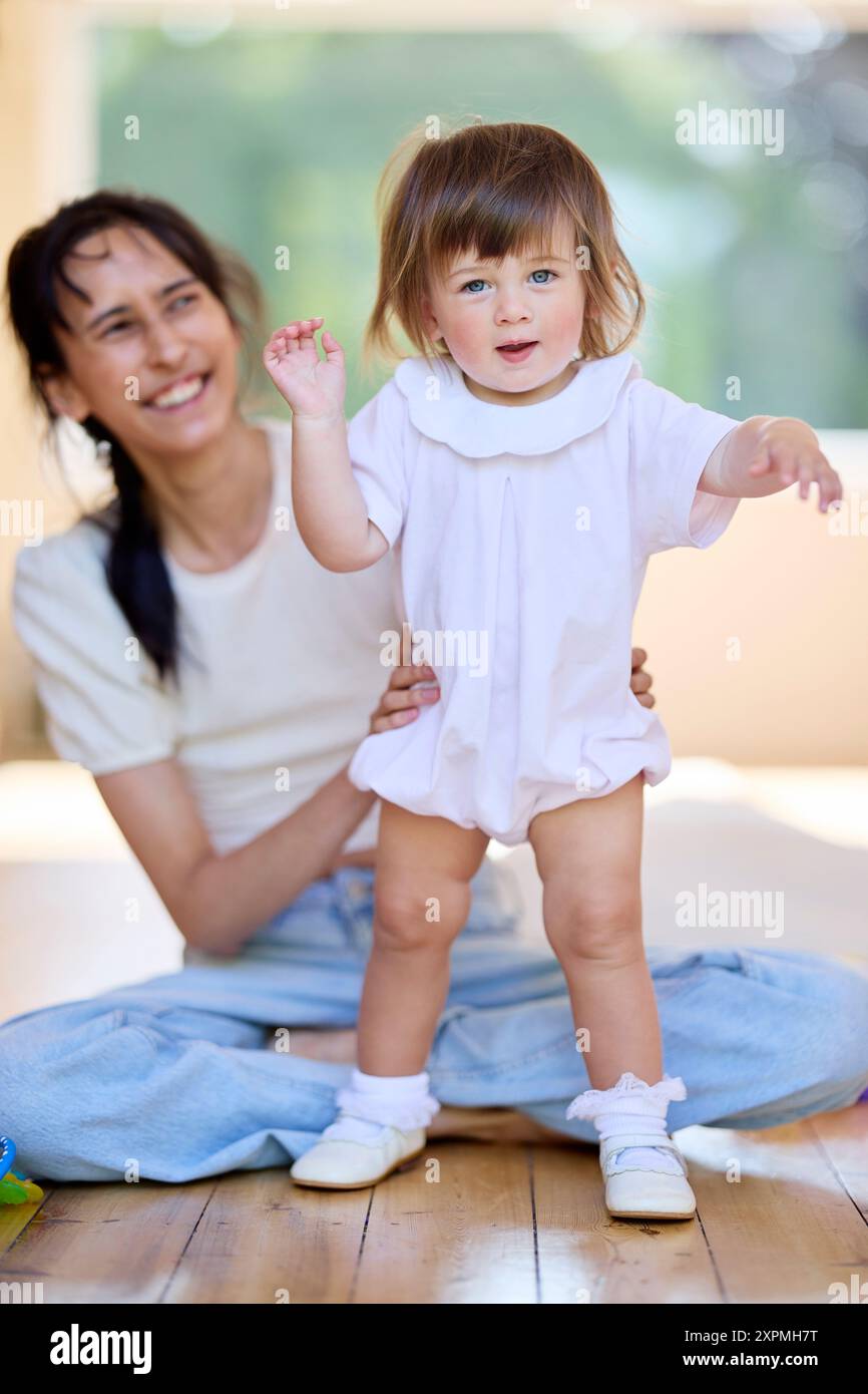 Your child sat reading a book Stock Photo - Alamy