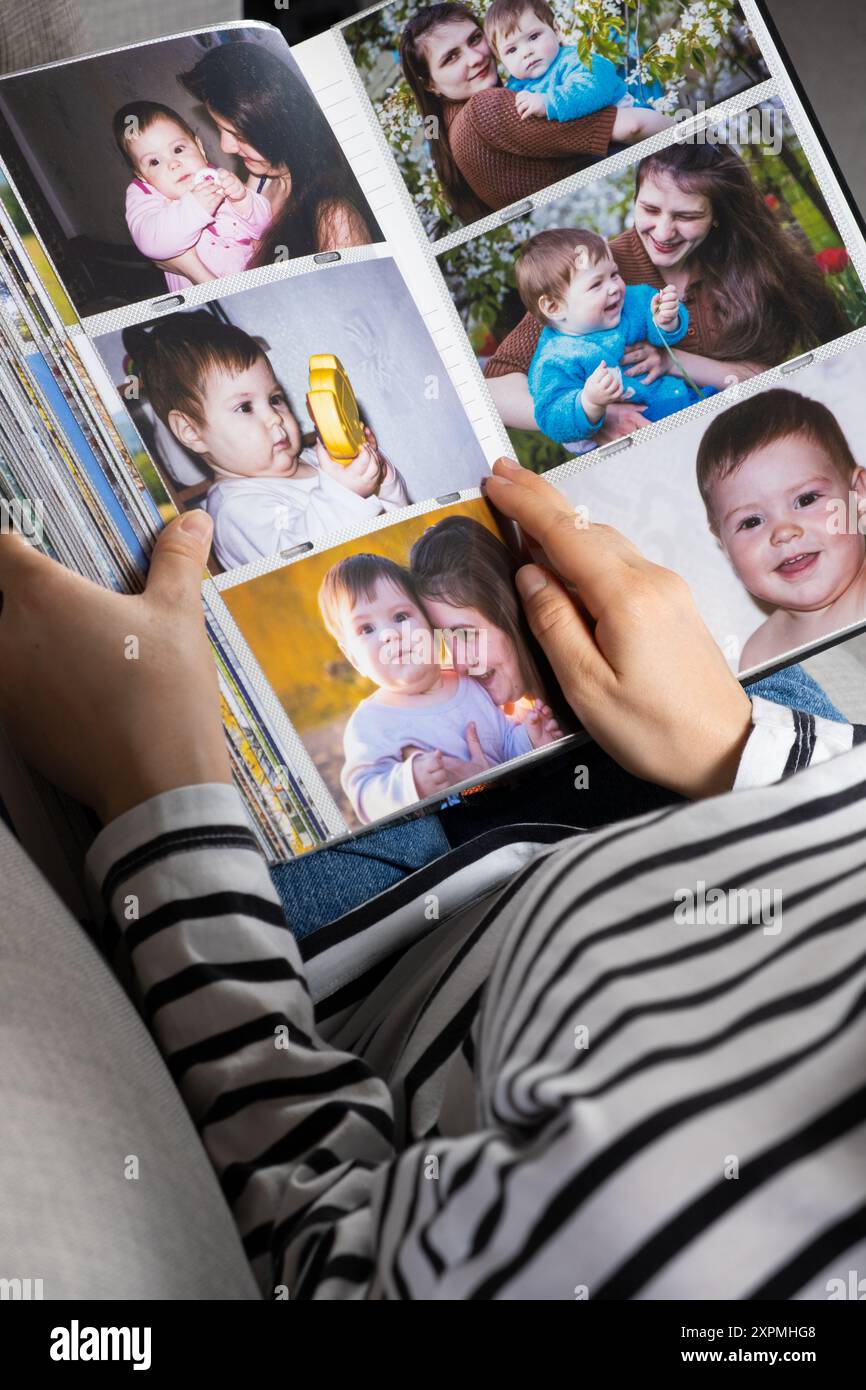 Toddler looking at photo album hi-res stock photography and images - Alamy