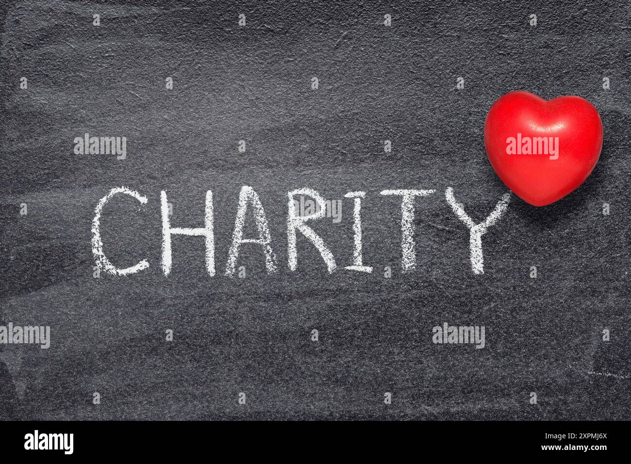 charity word written on chalkboard with red heart symbol Stock Photo ...