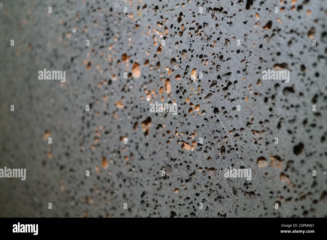 Wallpaper of basalt surface, closeup of photo with selective focus ...