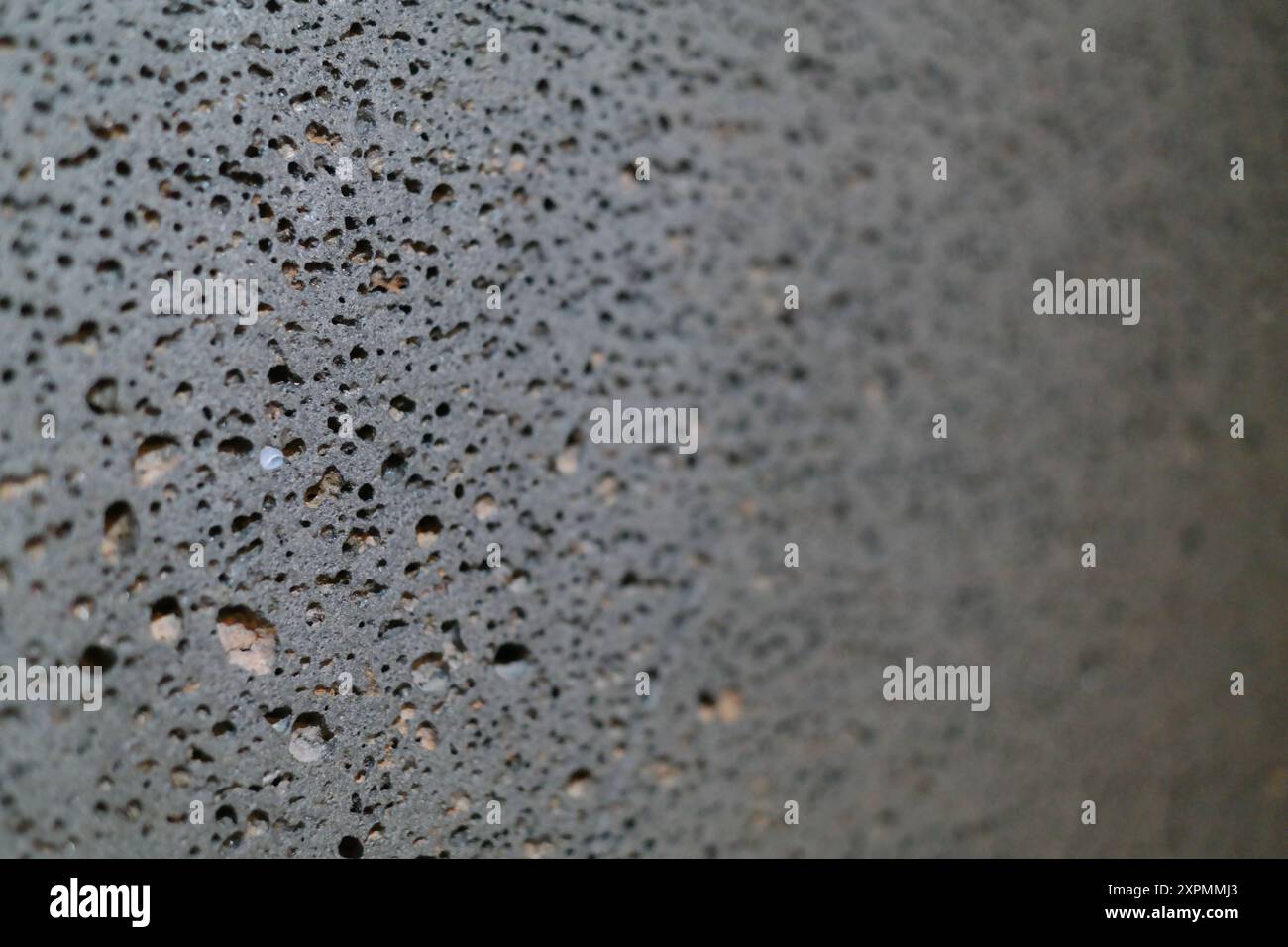 Wallpaper of basalt surface, closeup of photo with selective focus ...