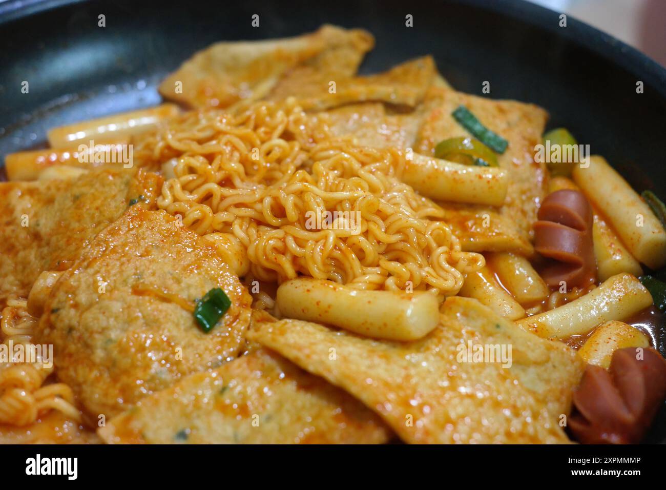 Korean food Tteokbokki, stir-fried rice cakes and fish cakes in a sweet ...