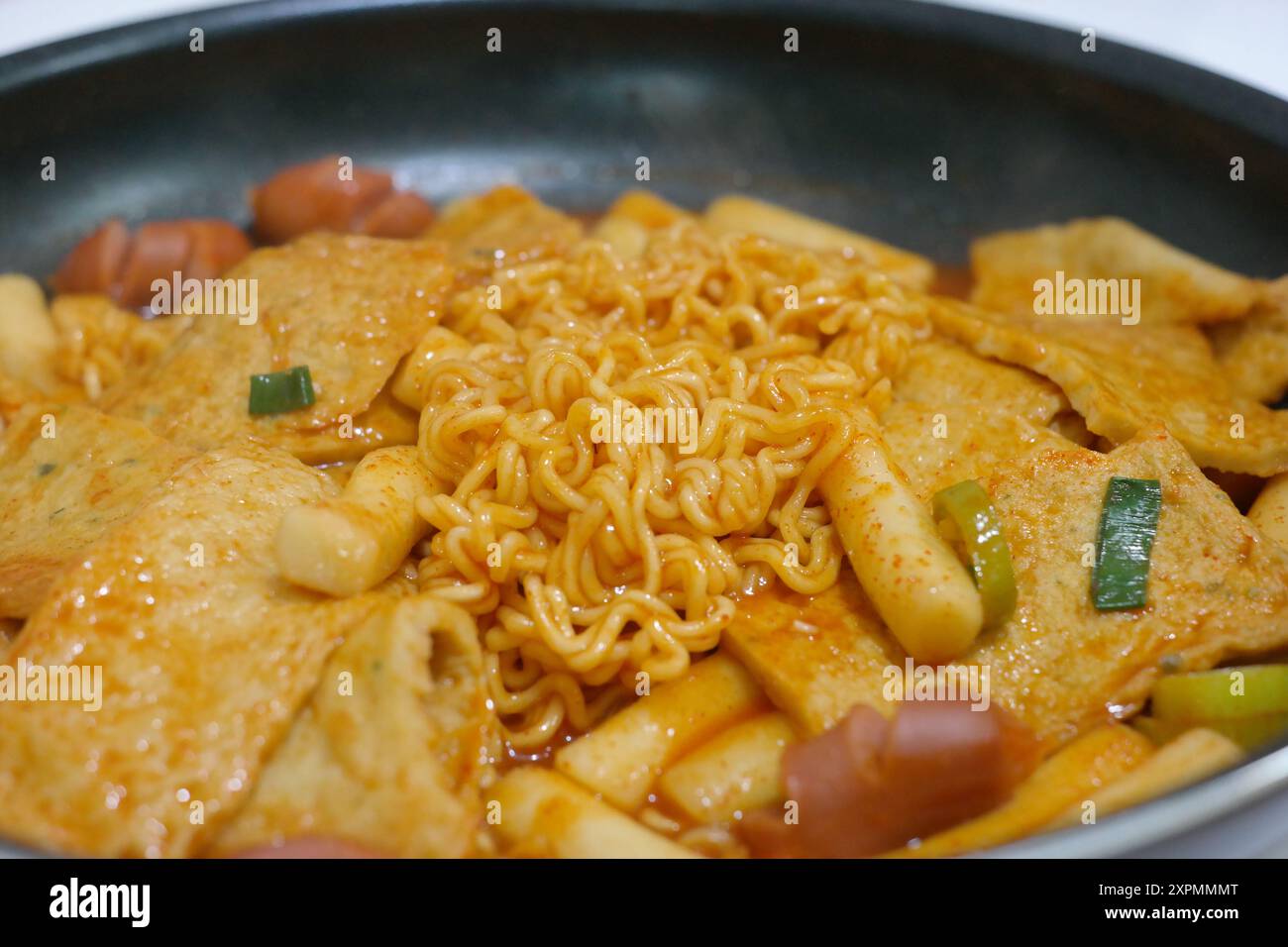 Korean food Tteokbokki, stir-fried rice cakes and fish cakes in a sweet ...