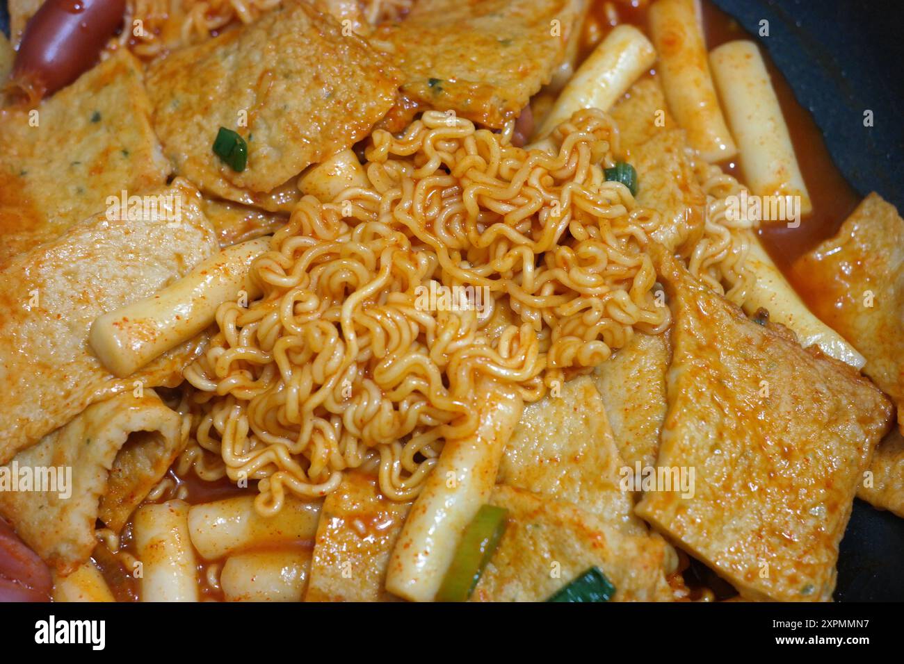 Korean food Tteokbokki, stir-fried rice cakes and fish cakes in a sweet ...