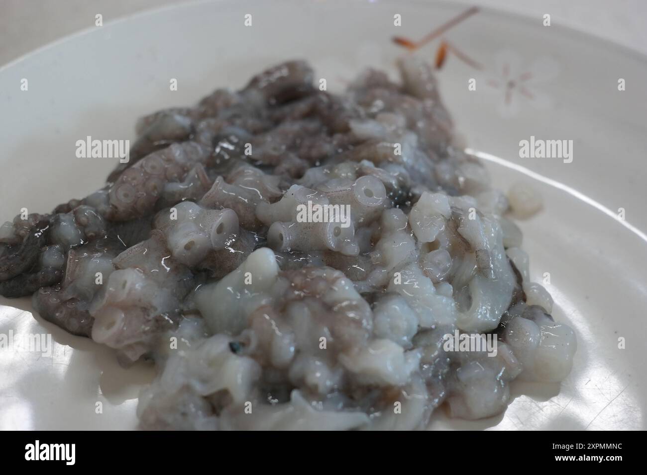 A Korean delicacy, raw octopus, cut into small pieces and eaten as is ...