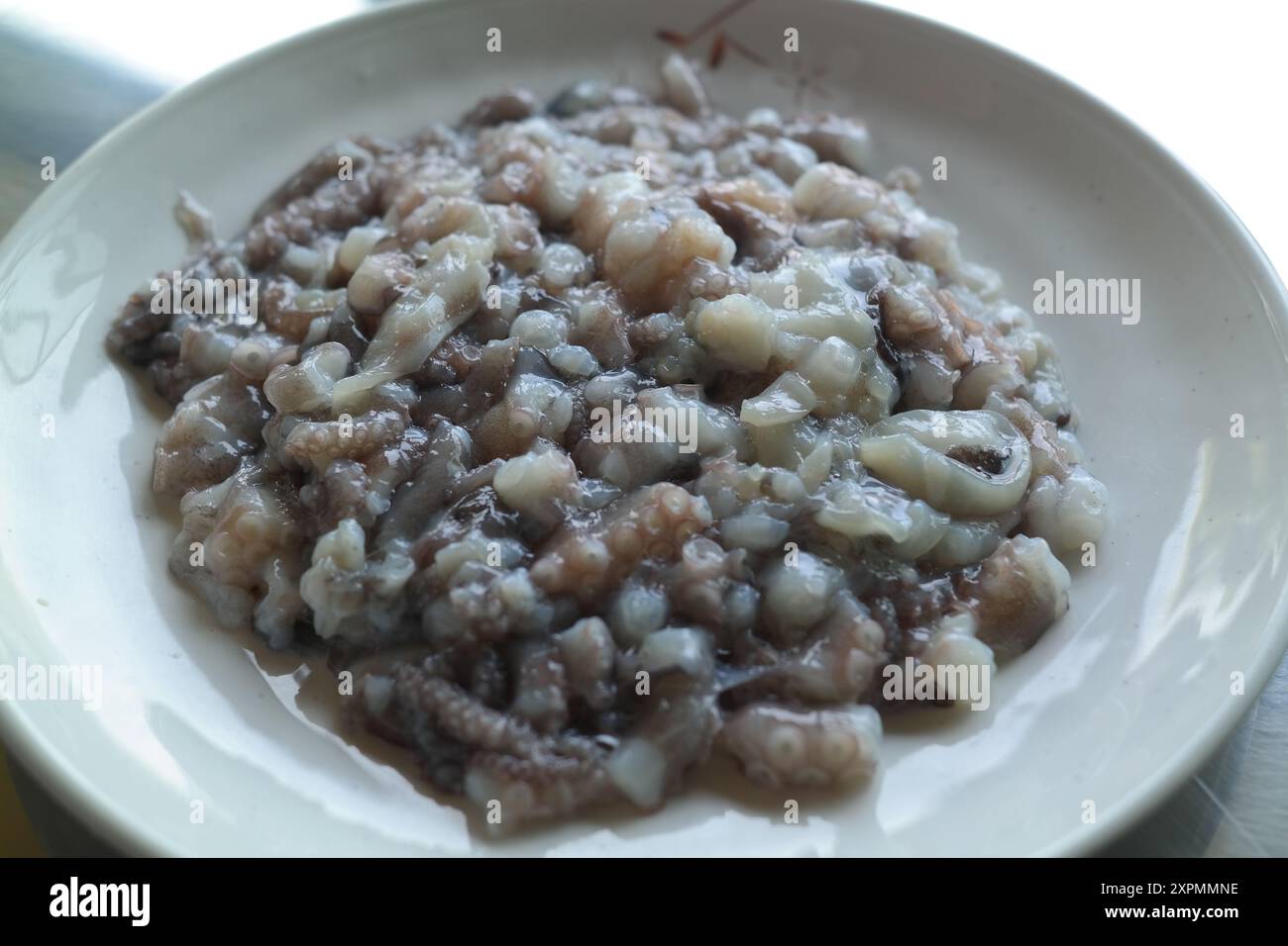 A Korean delicacy, raw octopus, cut into small pieces and eaten as is ...