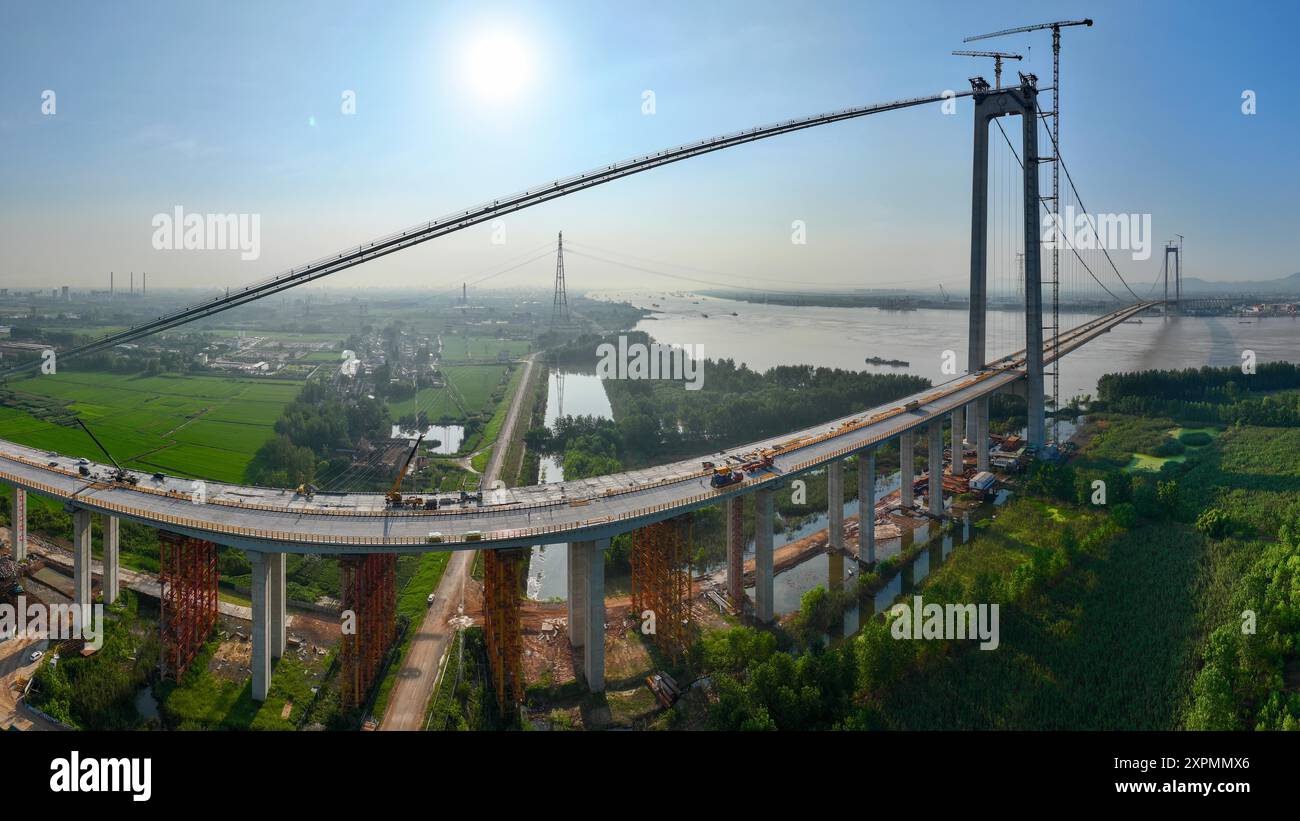 Aerial photo shows the Longtan Yangtze River Bridge under construction ...