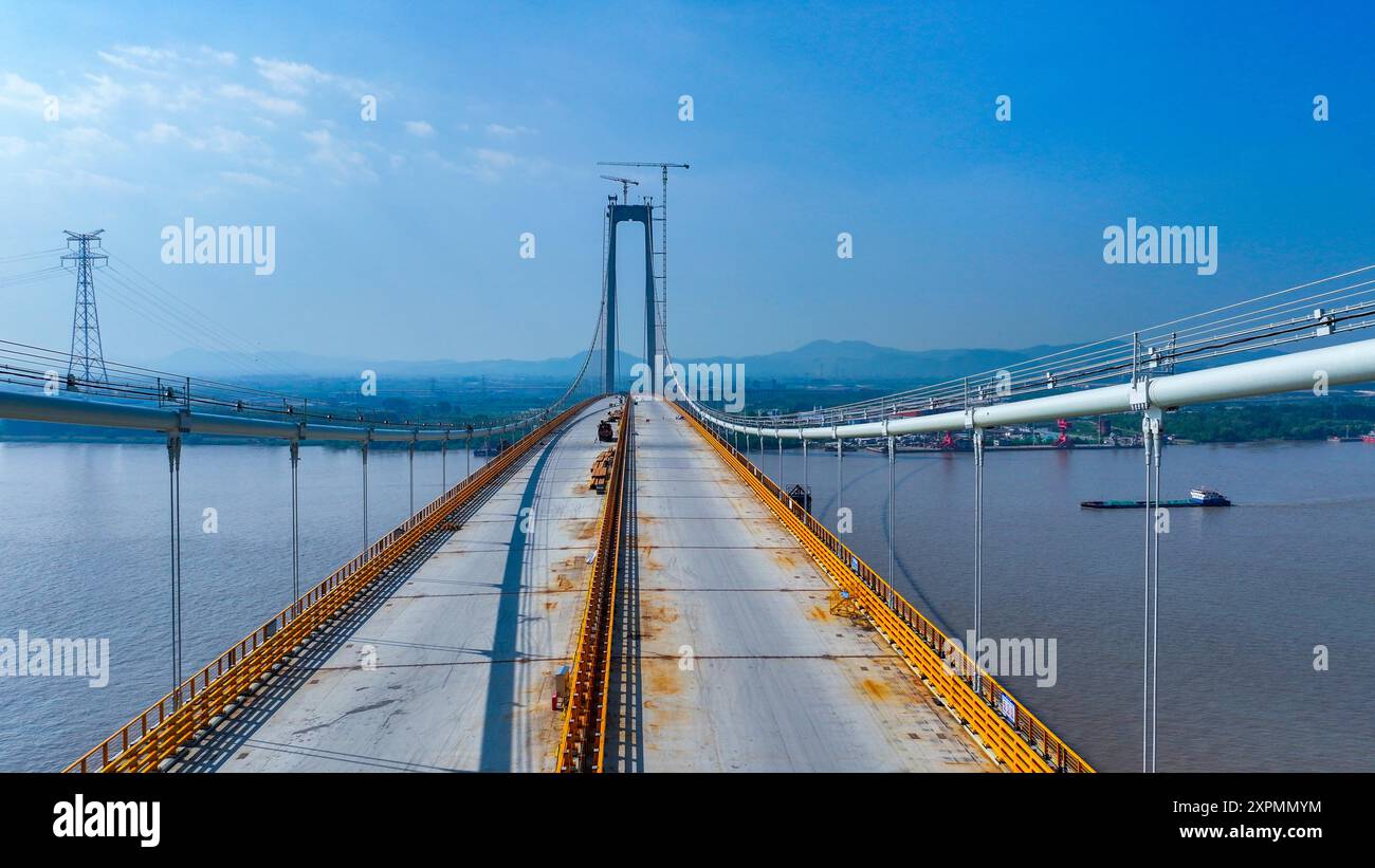 Aerial photo shows the Longtan Yangtze River Bridge under construction ...